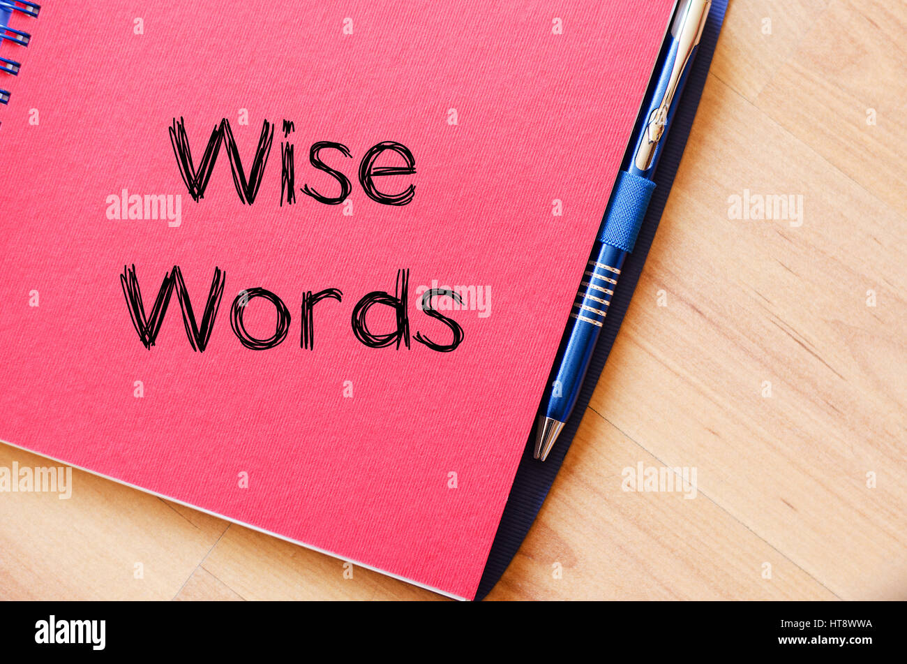 Wise words text concept write on notebook Stock Photo - Alamy