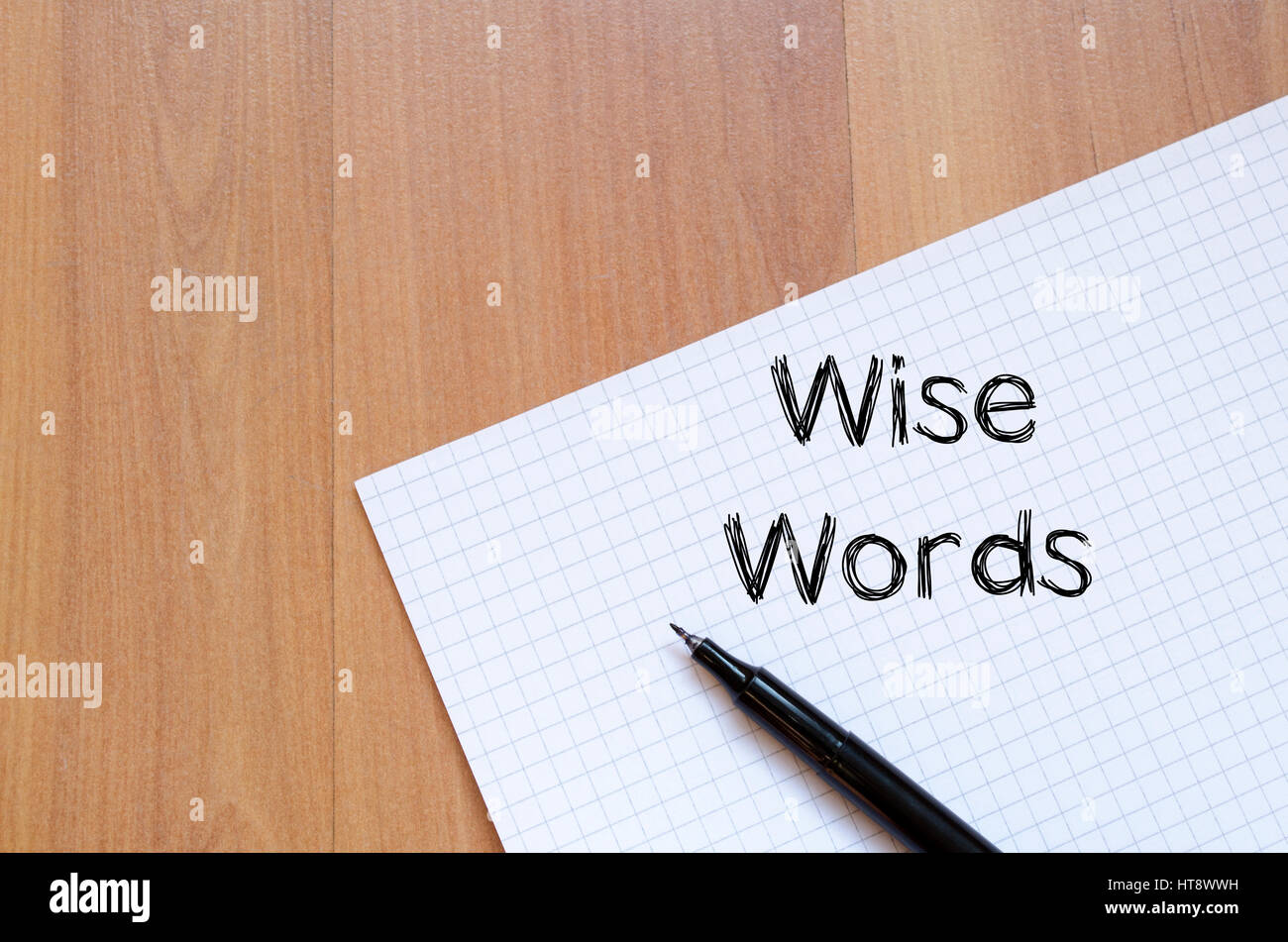 Wise words text concept write on notebook Stock Photo - Alamy