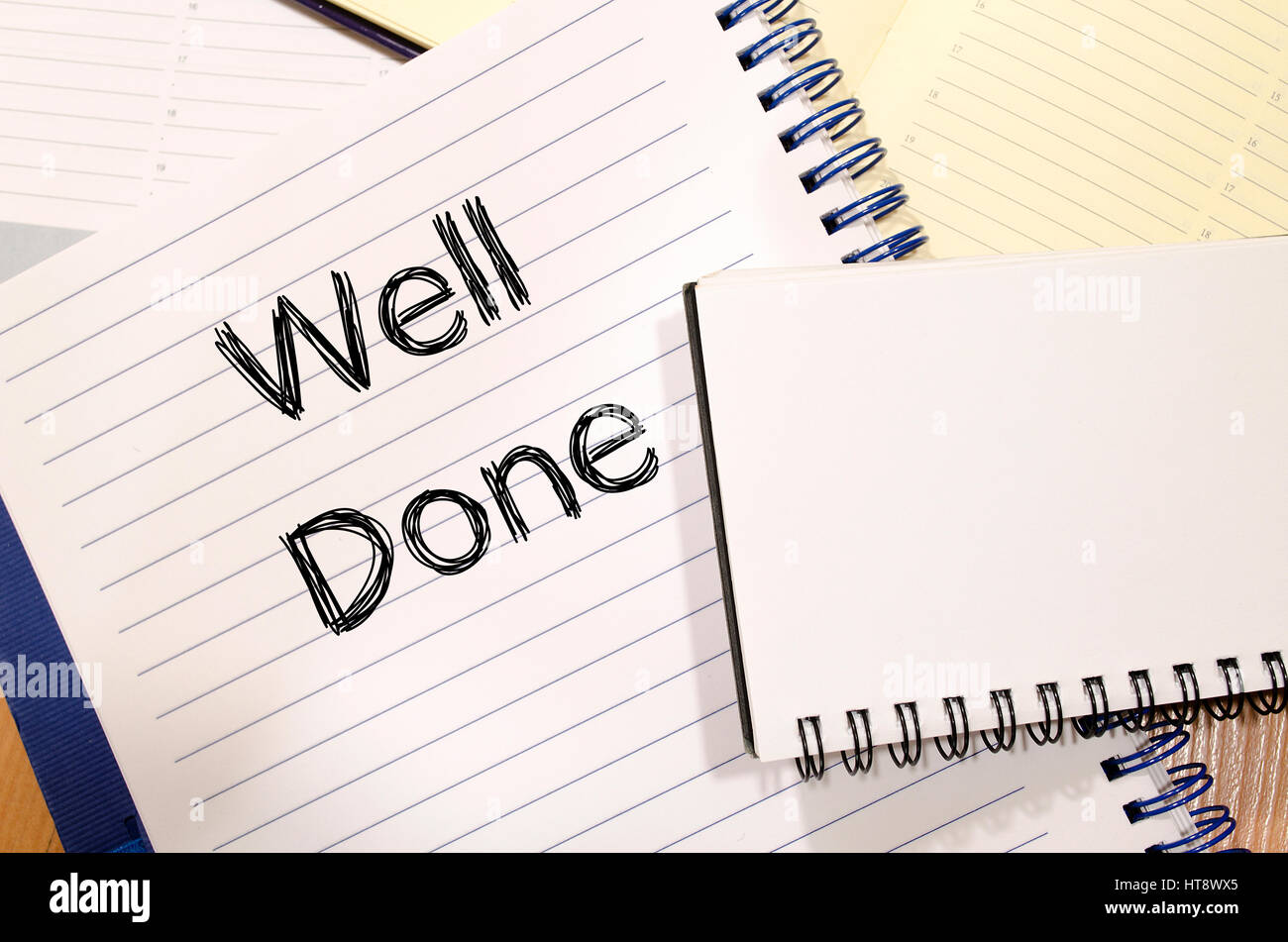 Well done text concept write on notebook Stock Photo - Alamy