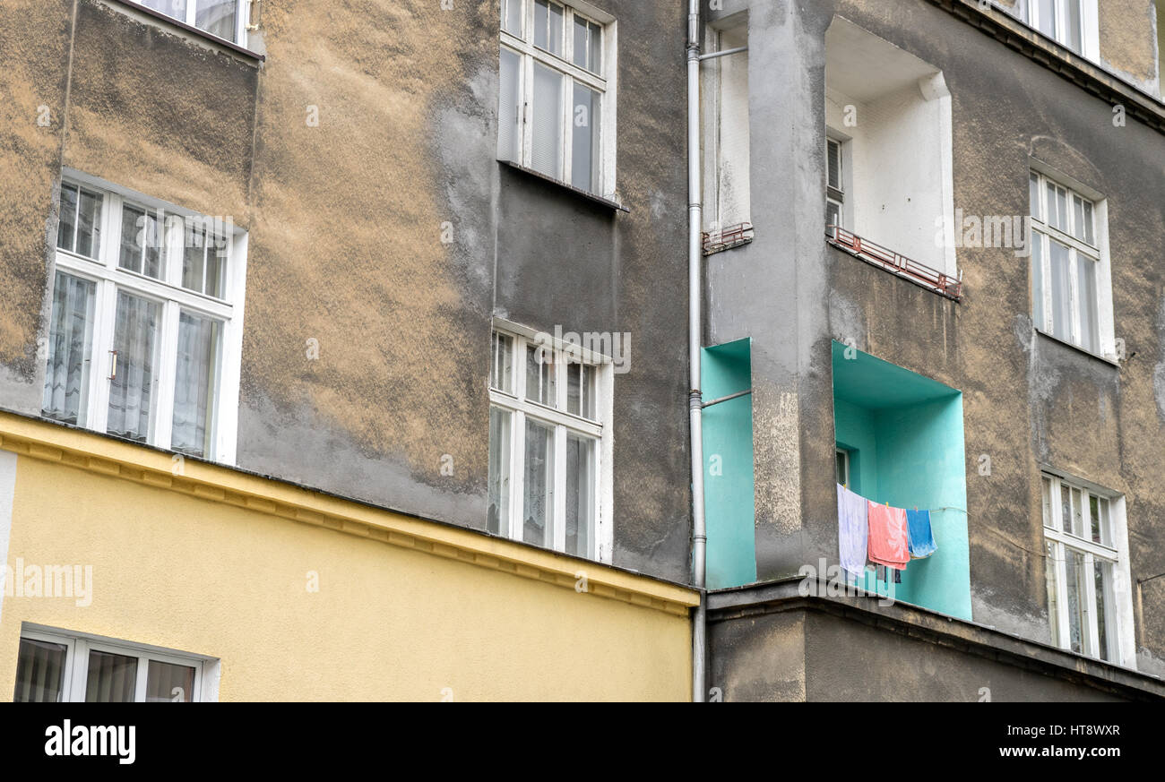 Gray house with a color painted balcony Stock Photo - Alamy