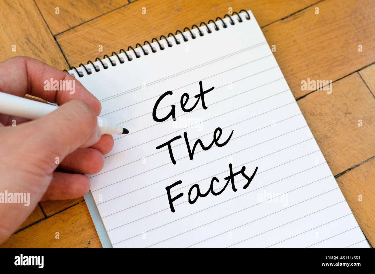 Get the facts text concept write on notebook Stock Photo - Alamy