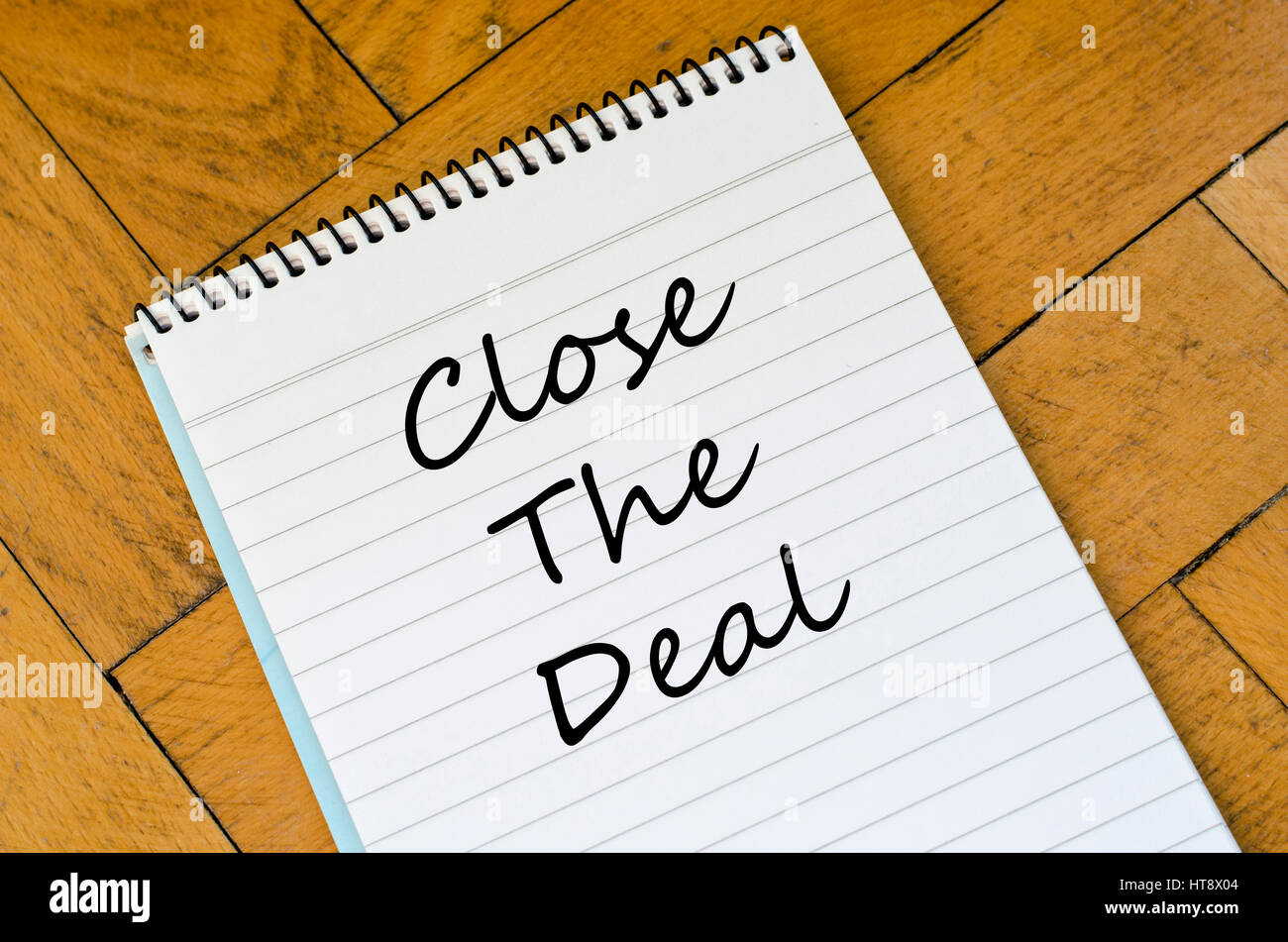 Close the deal text concept write on notebook Stock Photo - Alamy