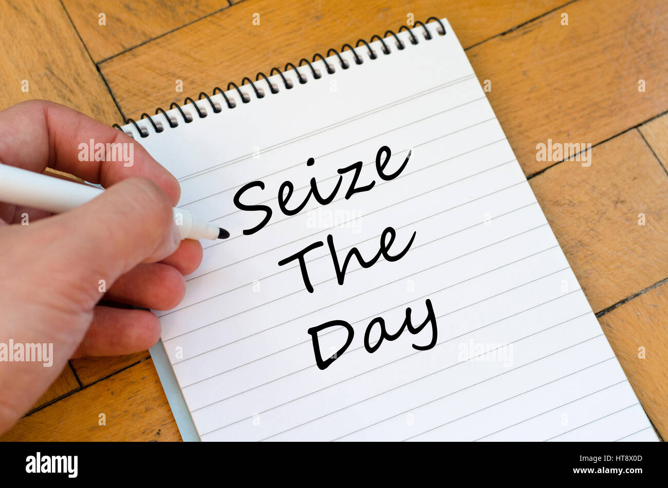 Seize the day text concept write on notebook Stock Photo - Alamy