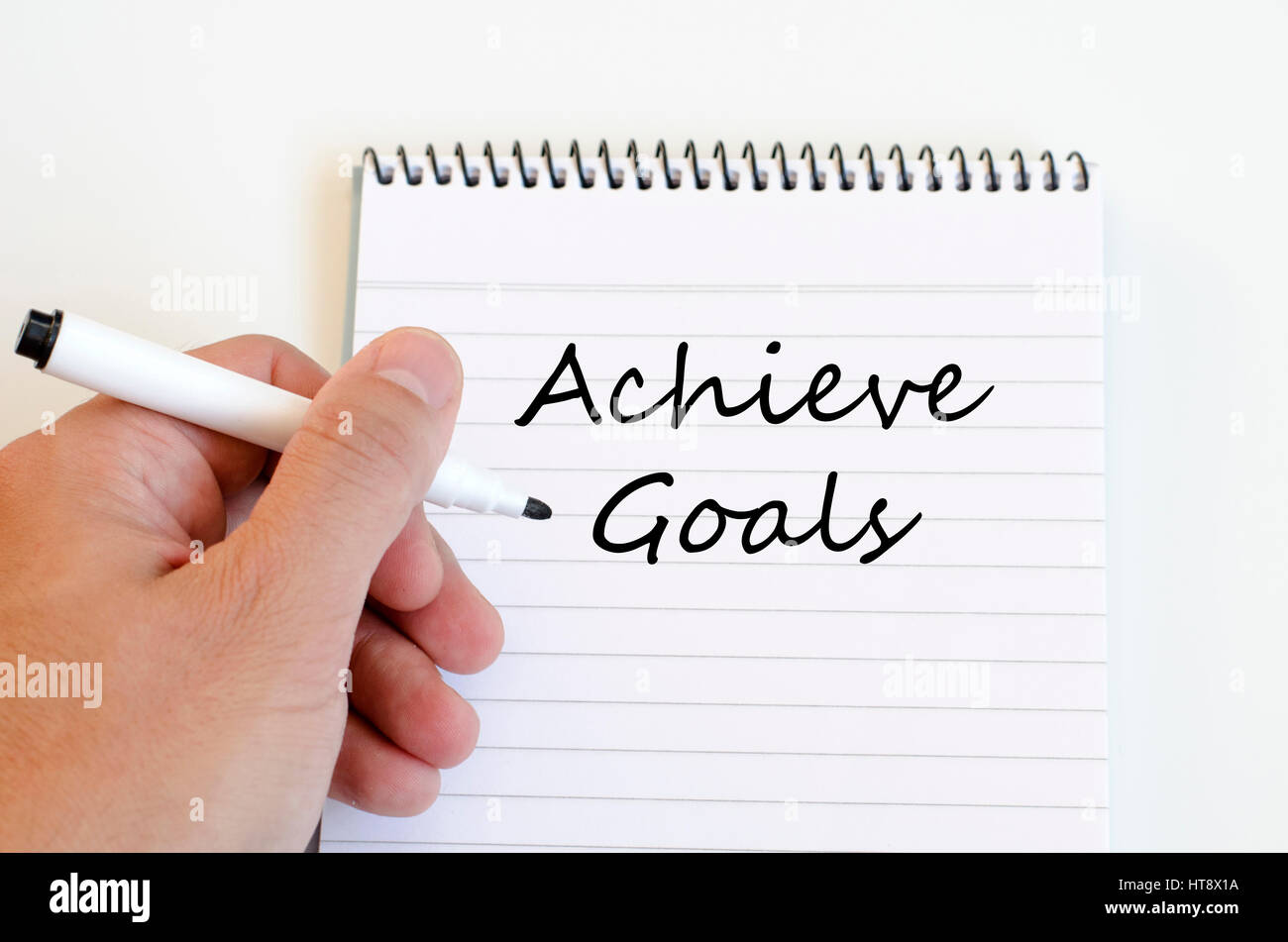 Achieve goals text concept write on notebook Stock Photo - Alamy