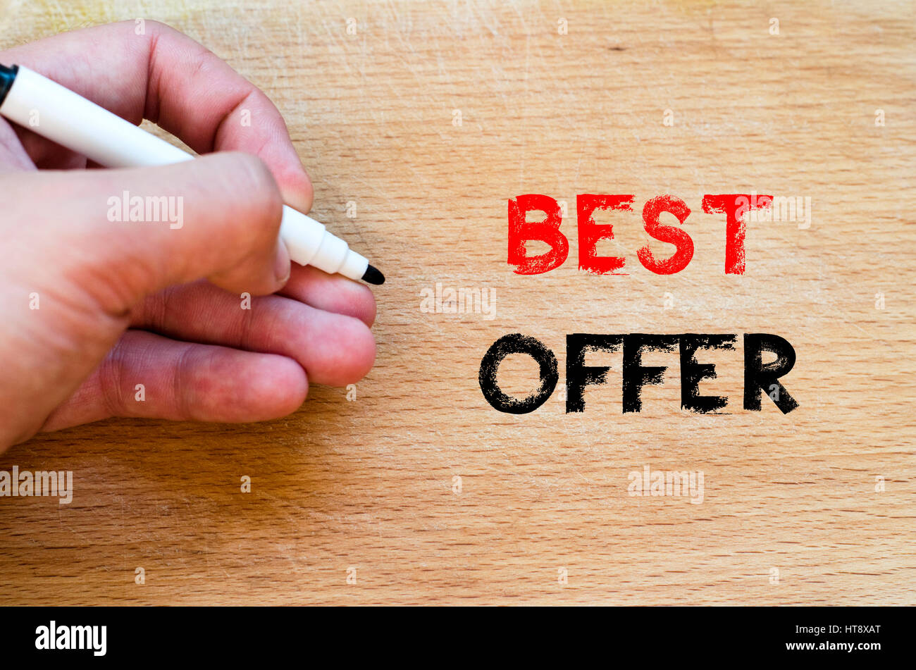 Human hand over wooden background and best offer text concept Stock ...