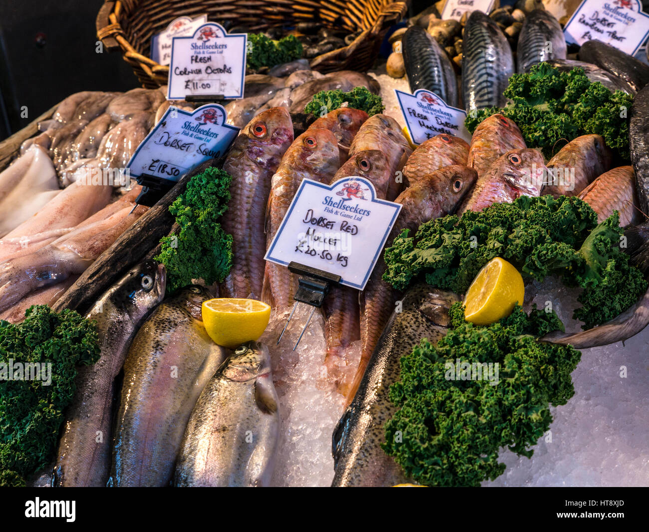 Fresh British seafood varieties on fishmongers market stall, displayed ...