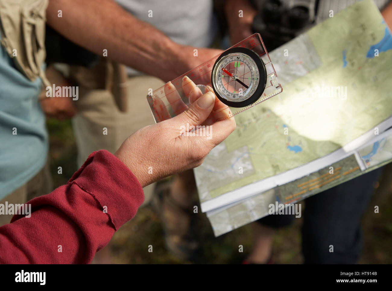 Man holding map compass close hi-res stock photography and images - Alamy