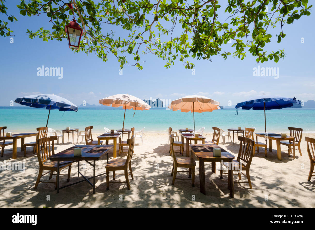 Group of chairs and umbellar along the clear beach Stock Photo - Alamy