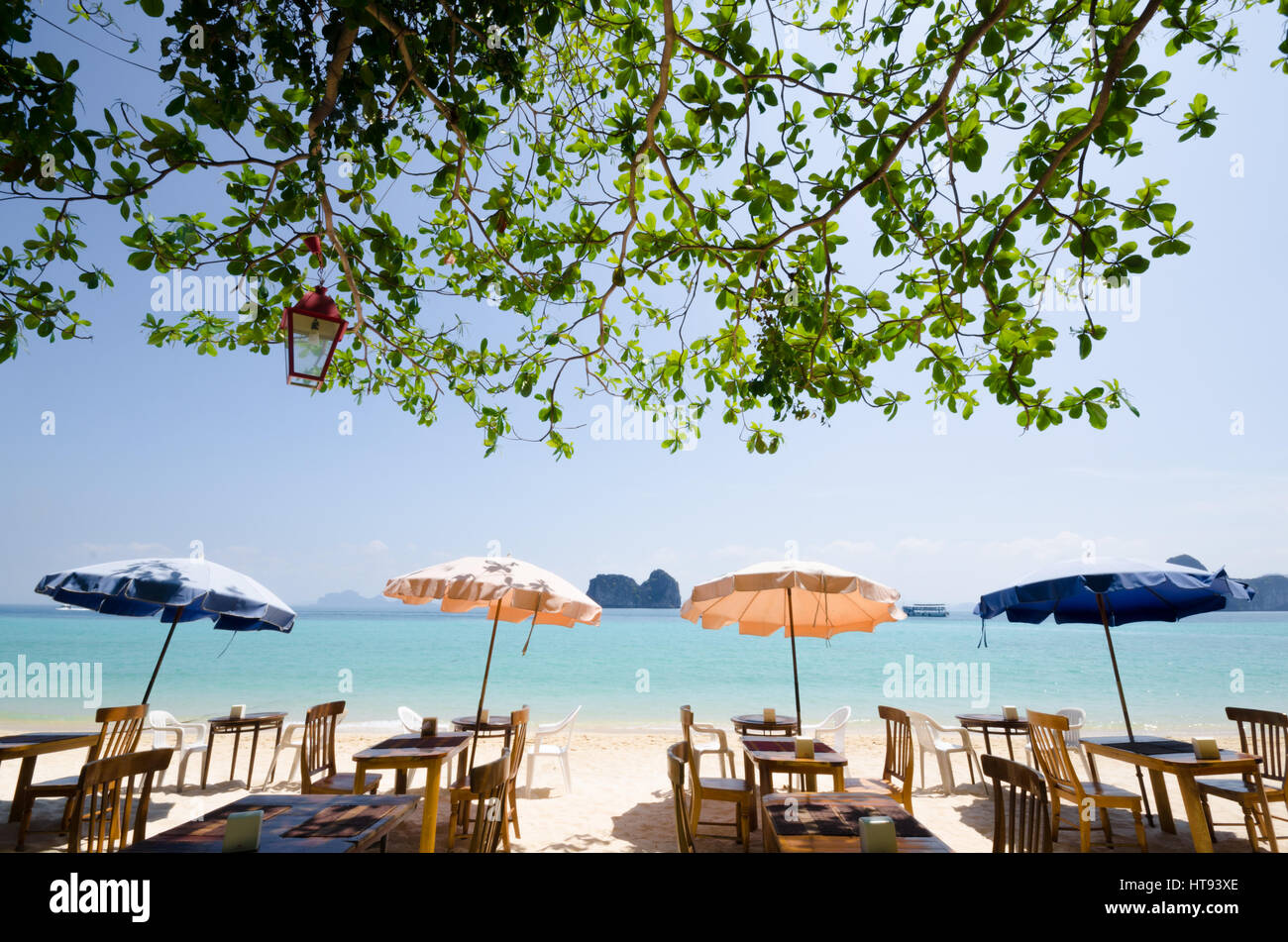 Group of chairs and umbellar along the clear beach Stock Photo - Alamy