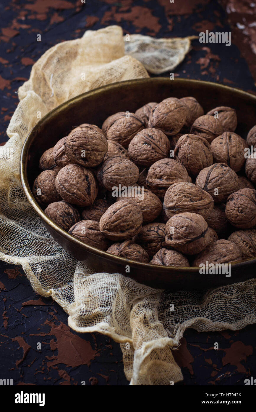 Walnuts on concrete background. Selective focus Stock Photo - Alamy