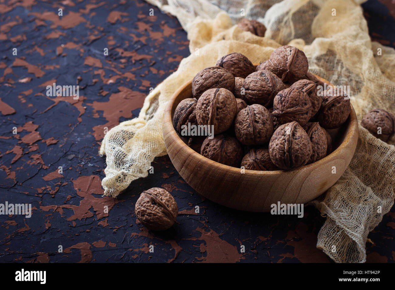 Walnuts on concrete background. Selective focus Stock Photo - Alamy