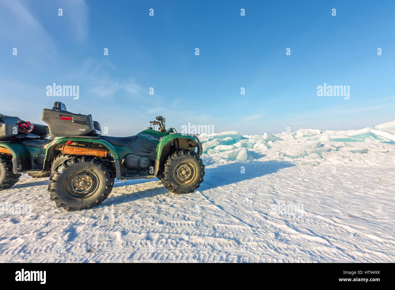 Quad bike on the ice bikala among hummocks Stock Photo - Alamy