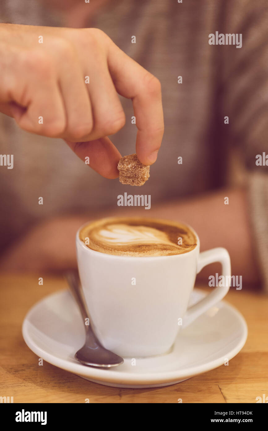 Detail image of an unrecognizable man drinking coffee Stock Photo - Alamy