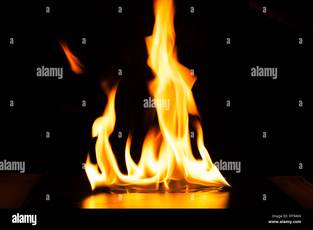 Burning fire flame on black background Stock Photo - Alamy