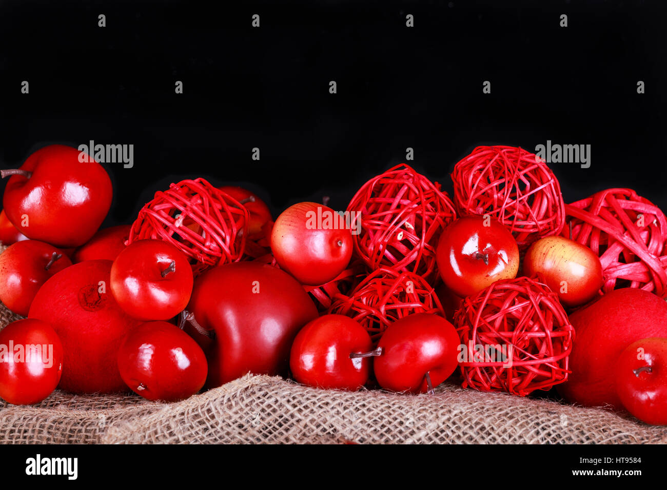 Red apples on burlap and black background, decoration concept Stock ...
