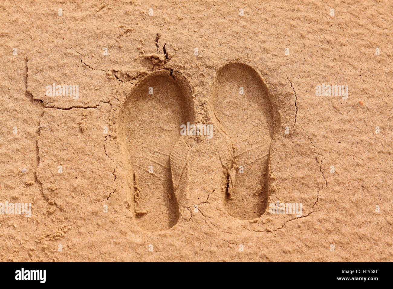 Footprint, sole of a shoe on the sand Stock Photo - Alamy