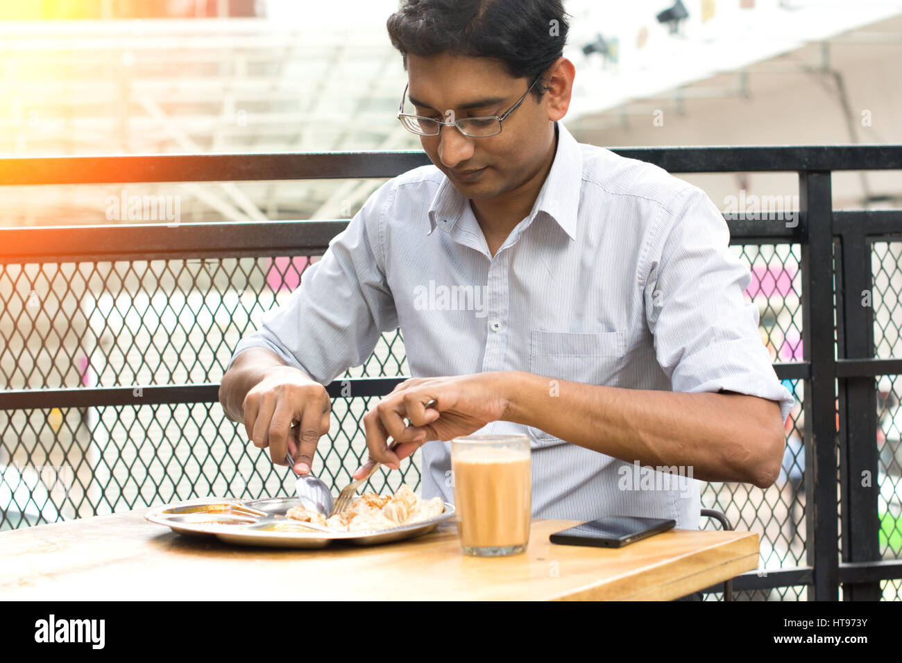 asian business man having roti canai outdoor Stock Photo - Alamy