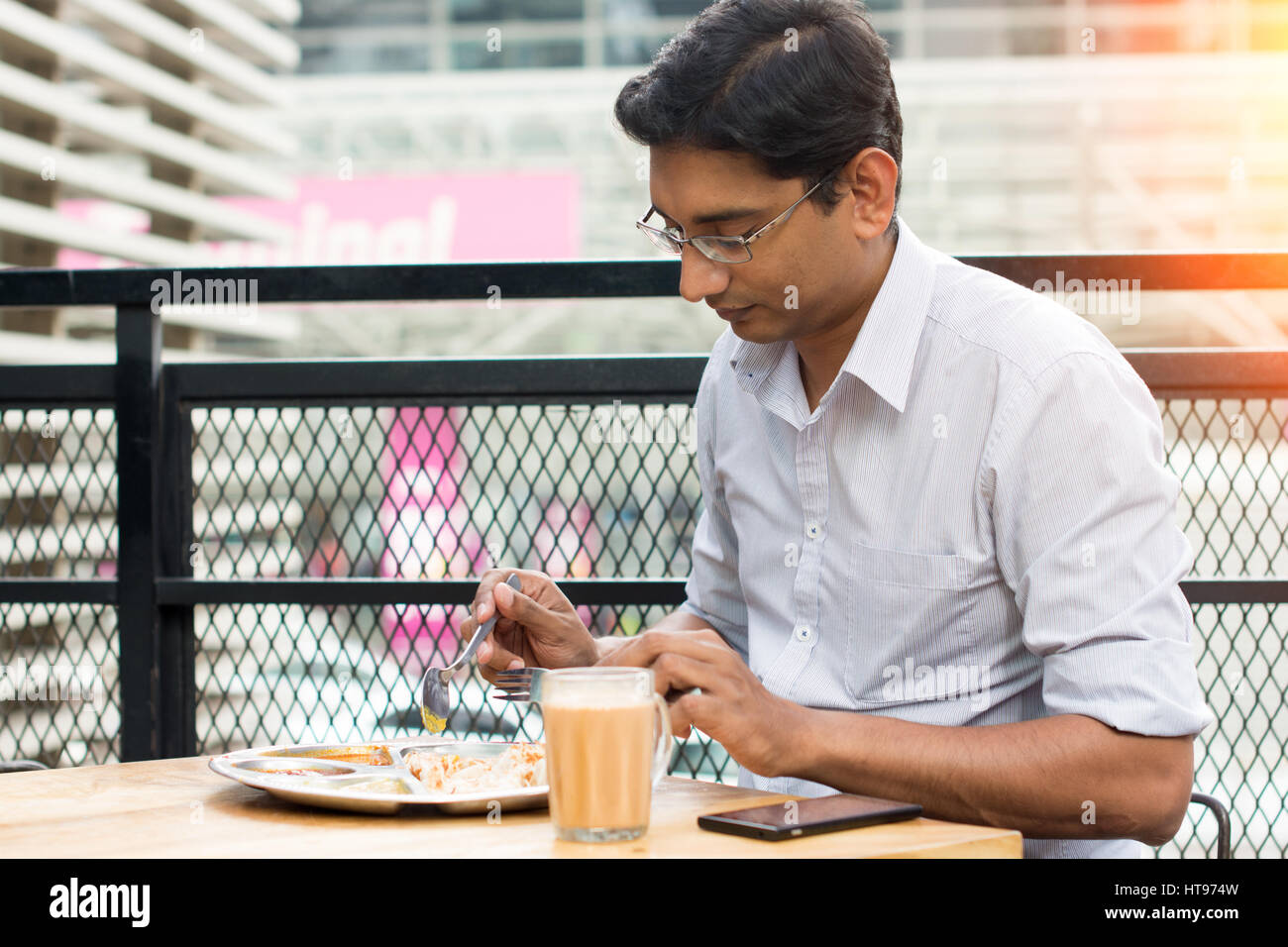 asian business man having roti canai outdoor Stock Photo - Alamy