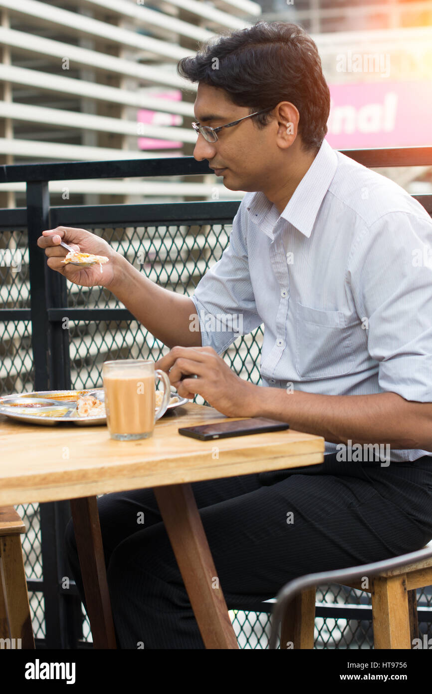 asian business man having roti canai outdoor Stock Photo - Alamy