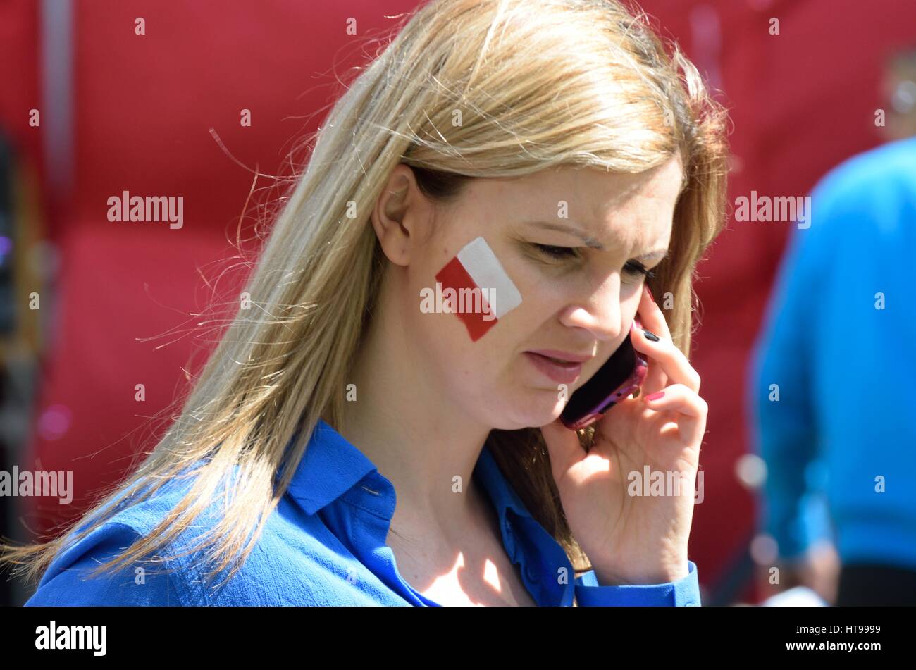 LONDON ENGLAND 9 May 2015: Pretty Polish girl with face painted with ...