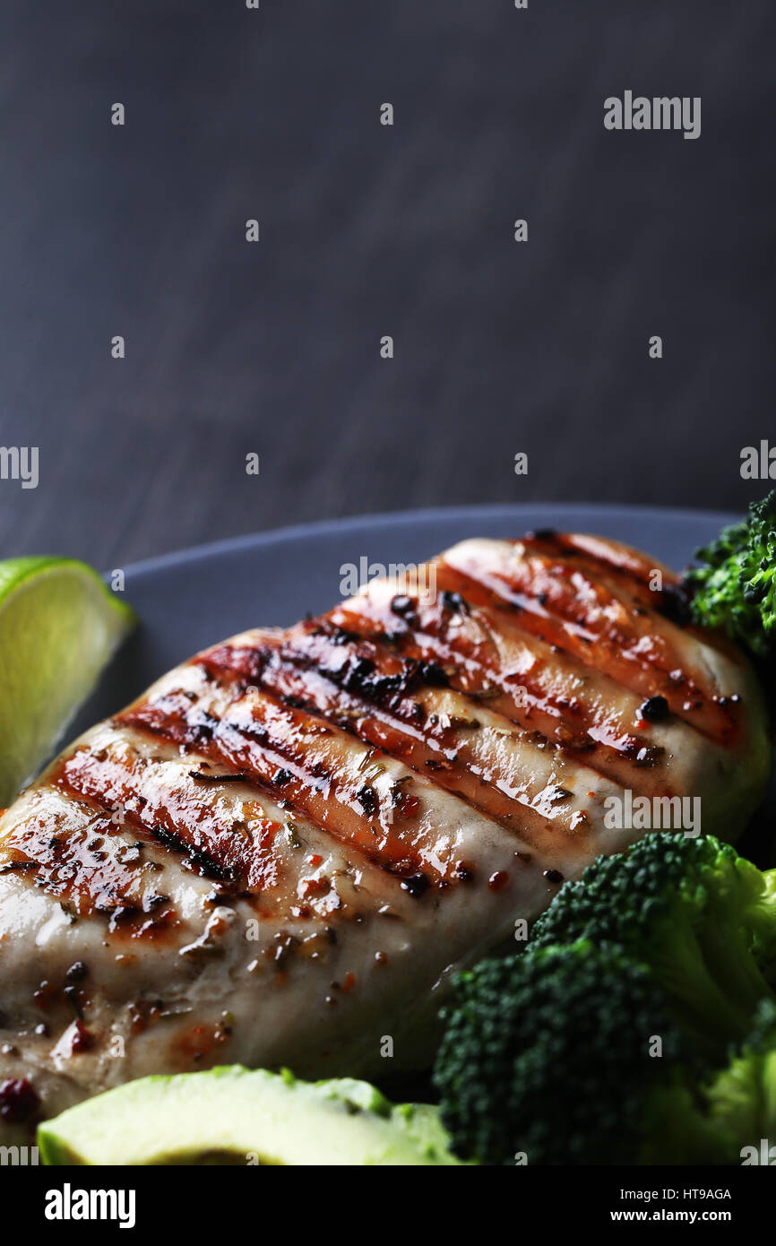 Dinner. Fried chicken fillet with vegetables Stock Photo - Alamy