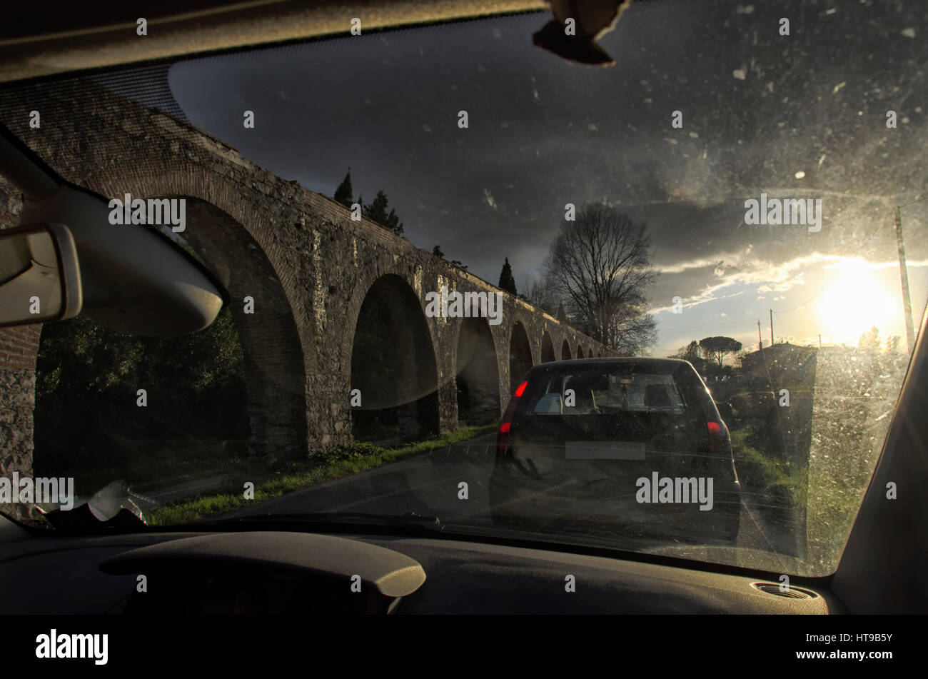 The arches of Roman aqueduct from inside the car Stock Photo - Alamy