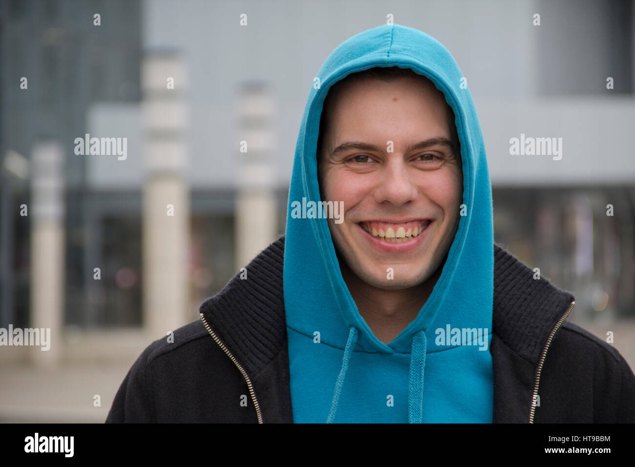 Young Man With A Blue Hood Stock Photo - Alamy
