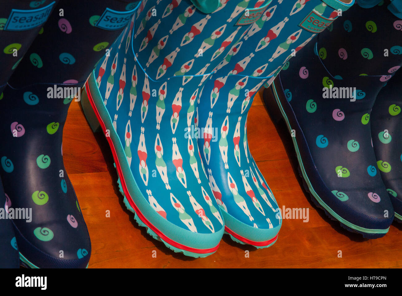 Wellington boots on shelf Stock Photo - Alamy