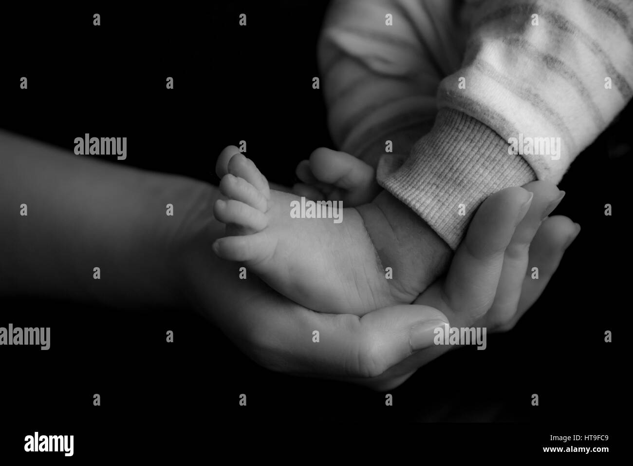 mother's protection is in her small gestures Stock Photo - Alamy