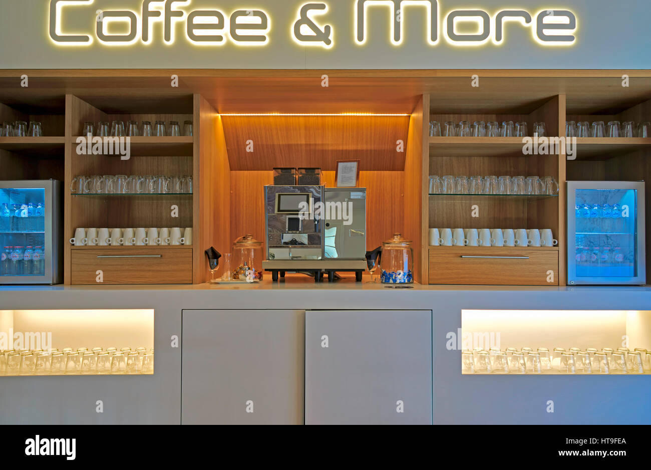 Interior lounge cafe of hotel. With coffee machine, cups, glass and ...