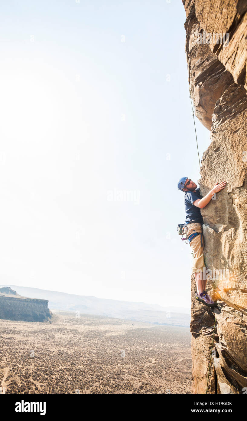 A man rock climbing in Echo Basin at the Vantage climbing area in ...
