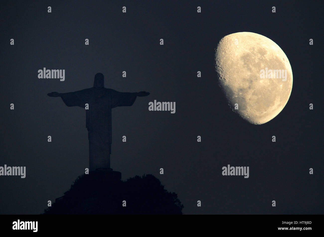 Christ the Redeemer and the moon at dawn in Rio de Janeiro, Brazil ...