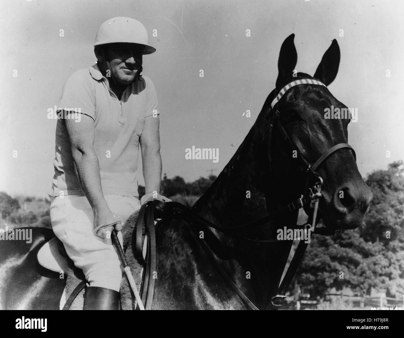 "A famous star, snapped at his favorite game...Spencer Tracy, Metro ...