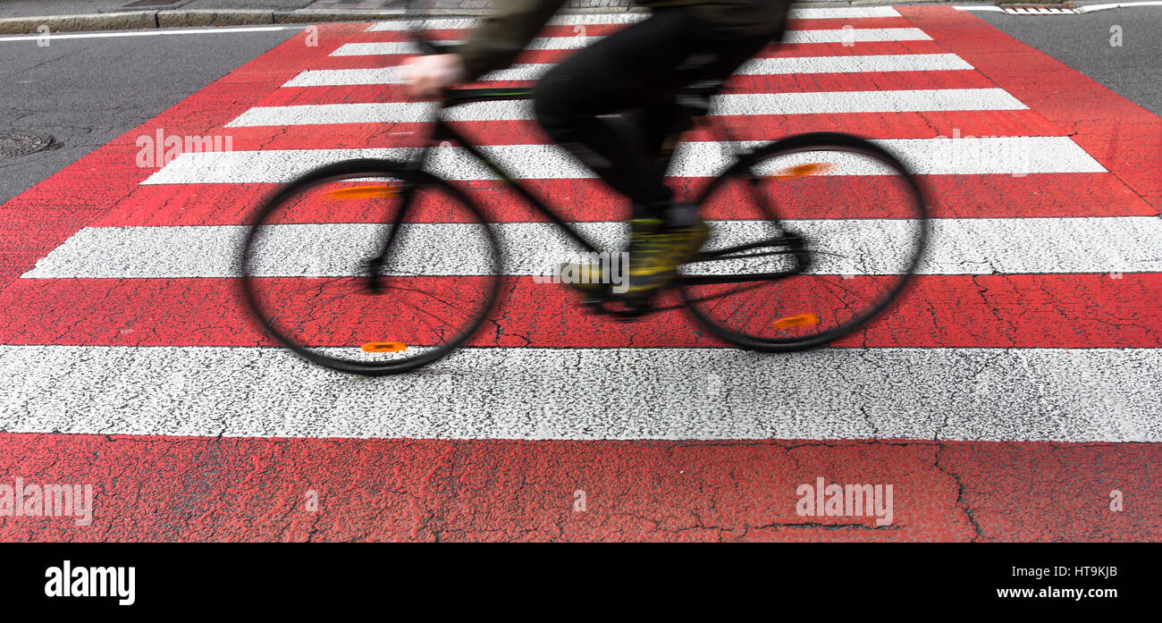 Cyclist on bicycle crossing the street Stock Photo - Alamy