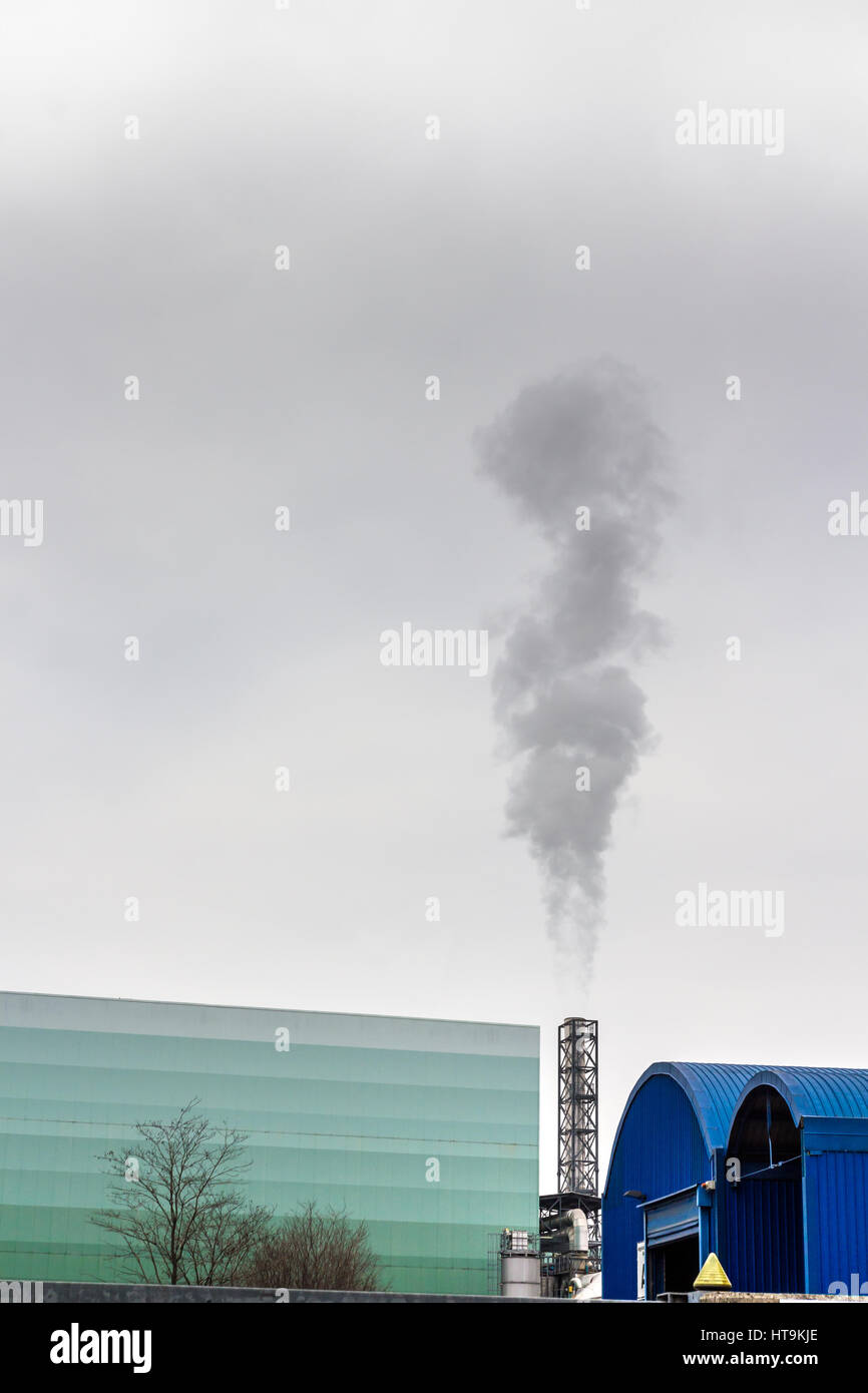Pollution of a factory with smog and chimney smoke Stock Photo - Alamy