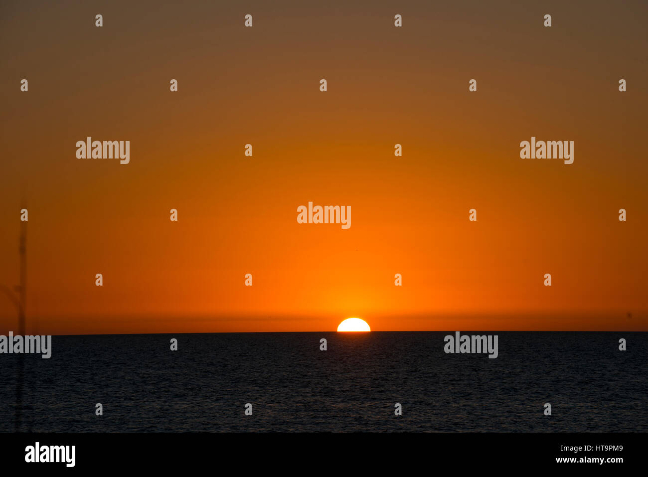 sunset over ocean Stock Photo - Alamy