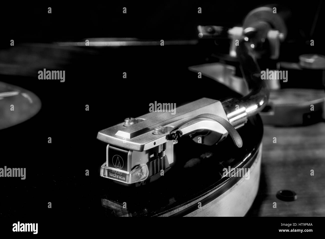 vintage stylists on album record player in black & white close up Stock ...