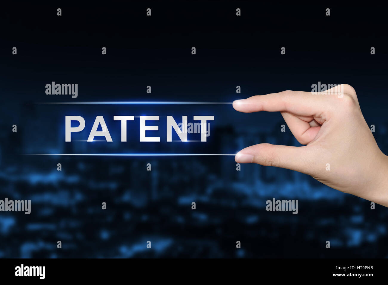 hand pushing patent button on blurred blue background Stock Photo - Alamy