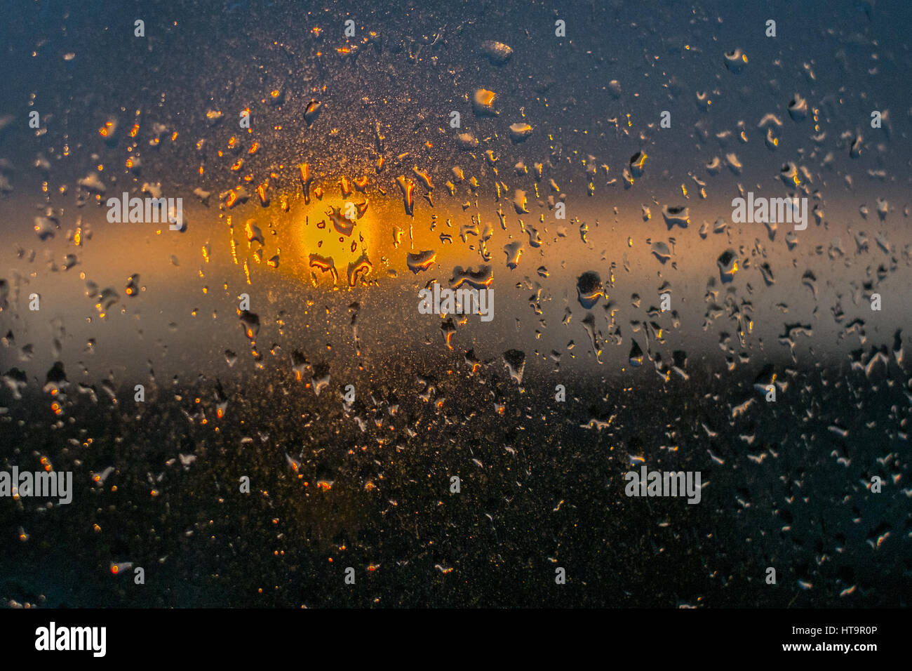 Unfocuced sun and water drops on the window Stock Photo - Alamy