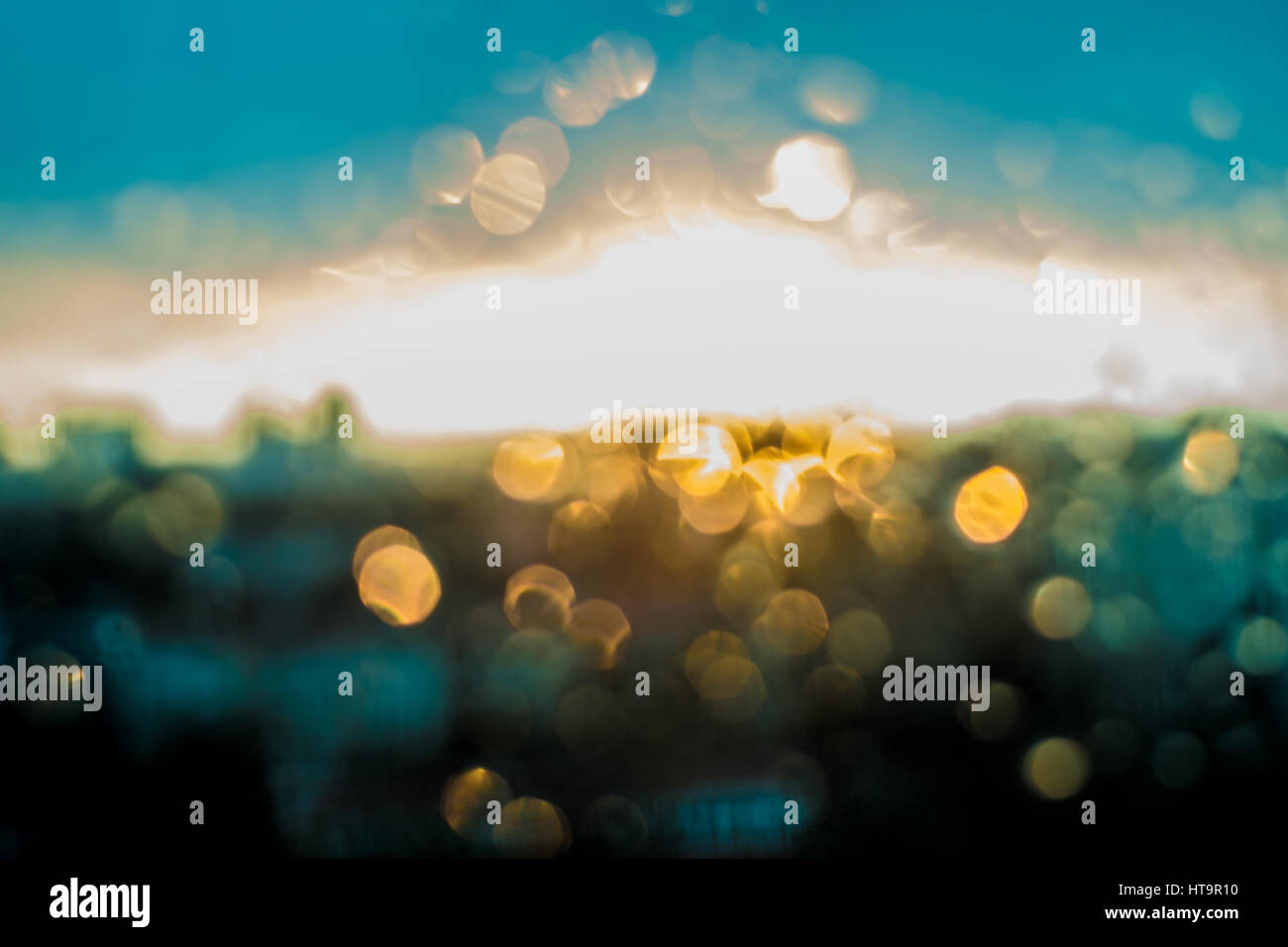 Unfocuced sun and water drops on the window Stock Photo - Alamy