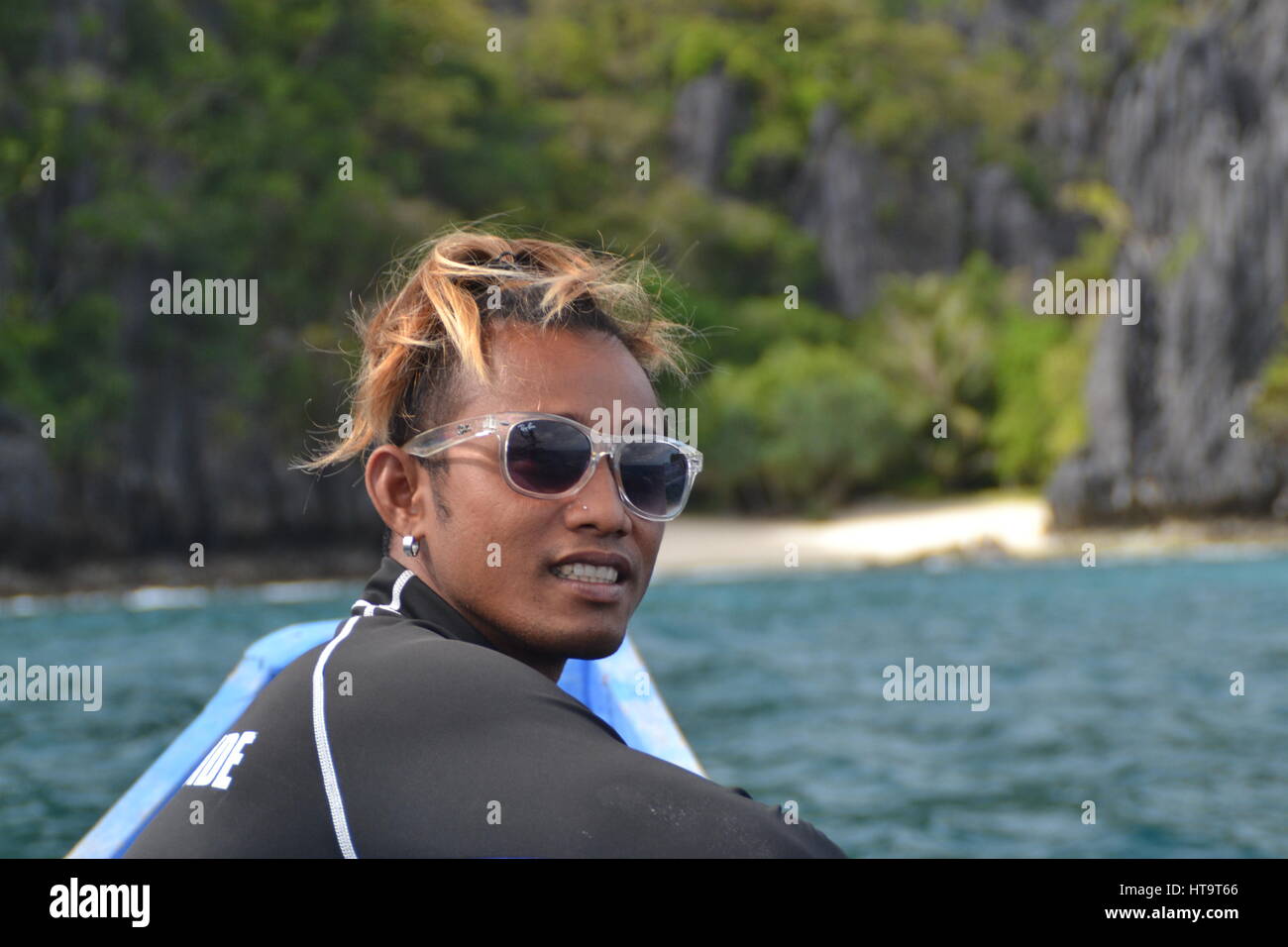 Native human on a boat near small island at El Nido Palawan ...