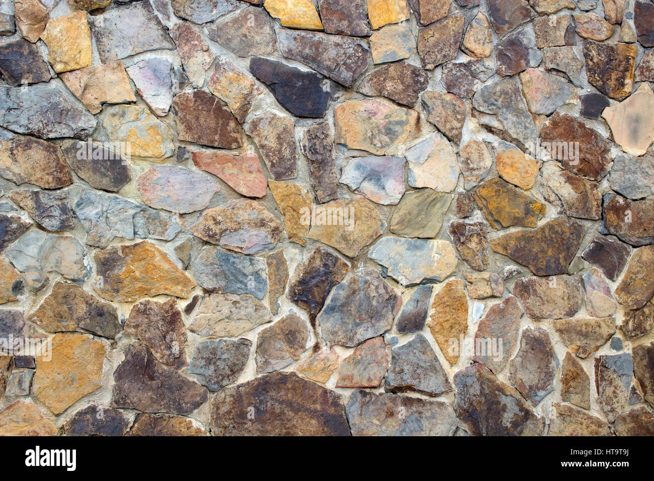 Close-up image of a stone wall Stock Photo - Alamy