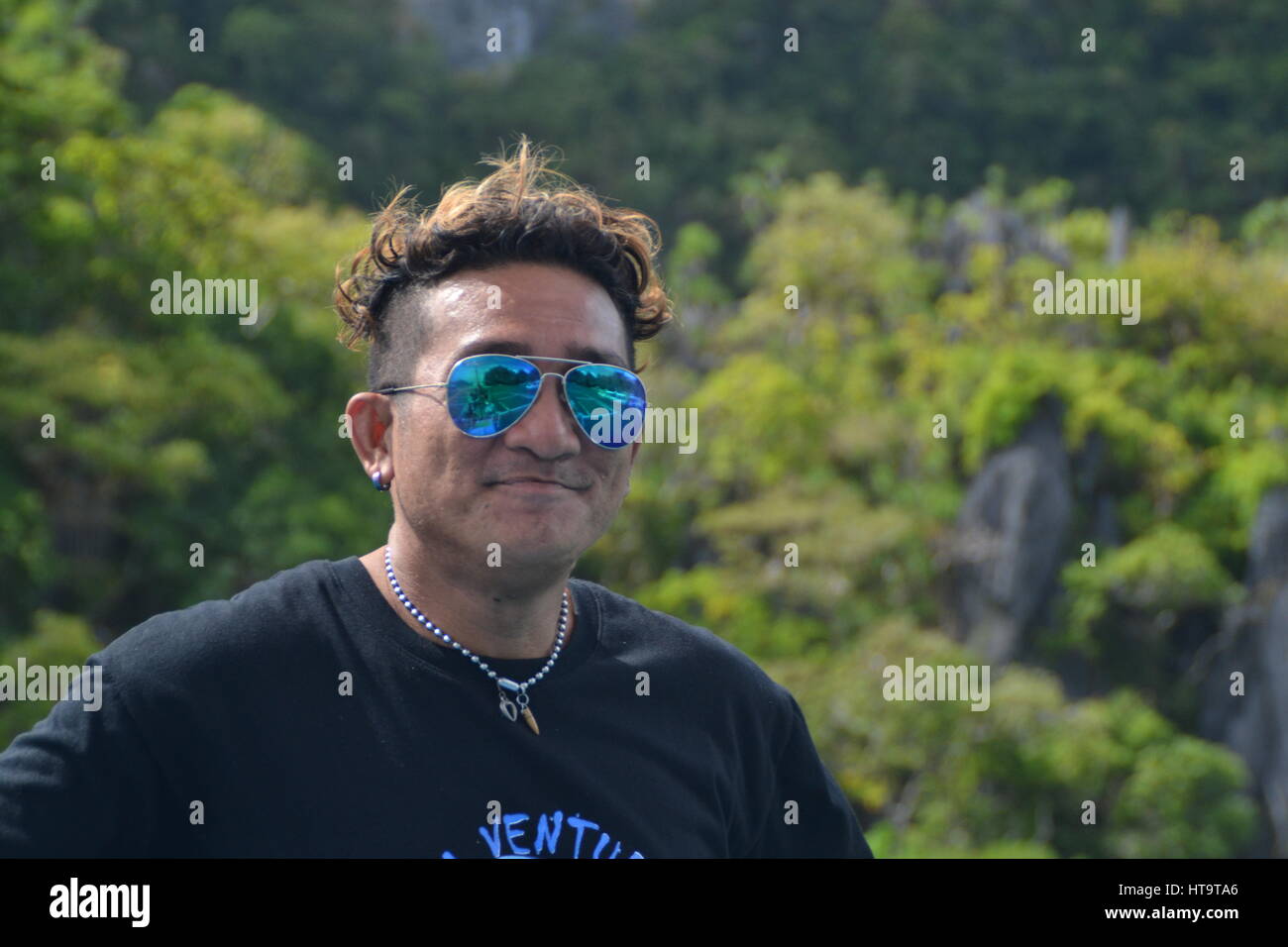 Native human on a boat near small island at El Nido Palawan ...