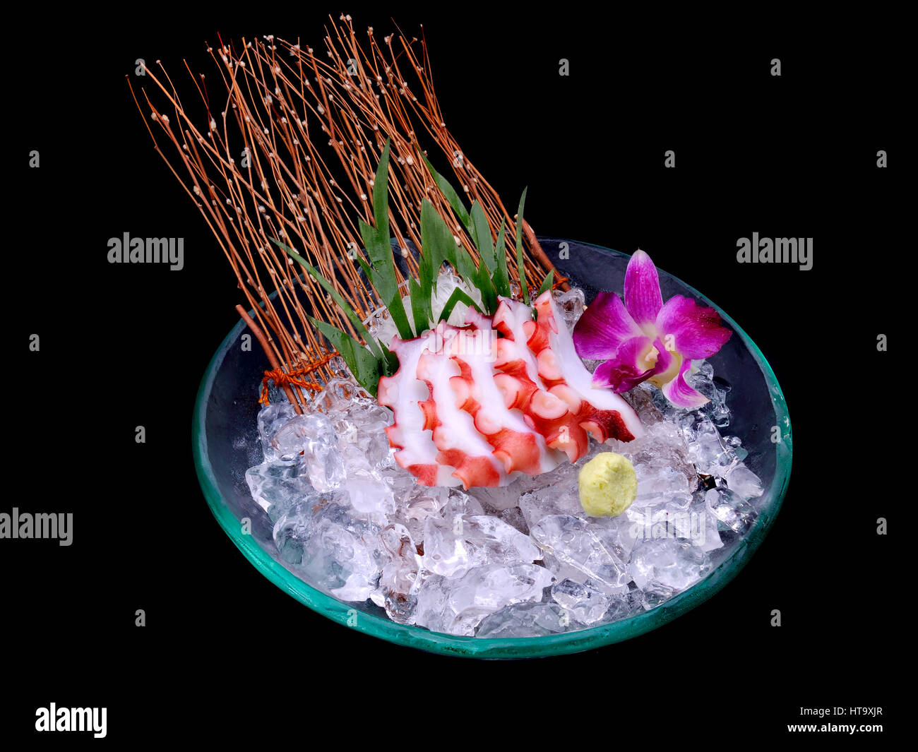 Japanese octopus tako sashimi serve on ice photo in studio lighting ...