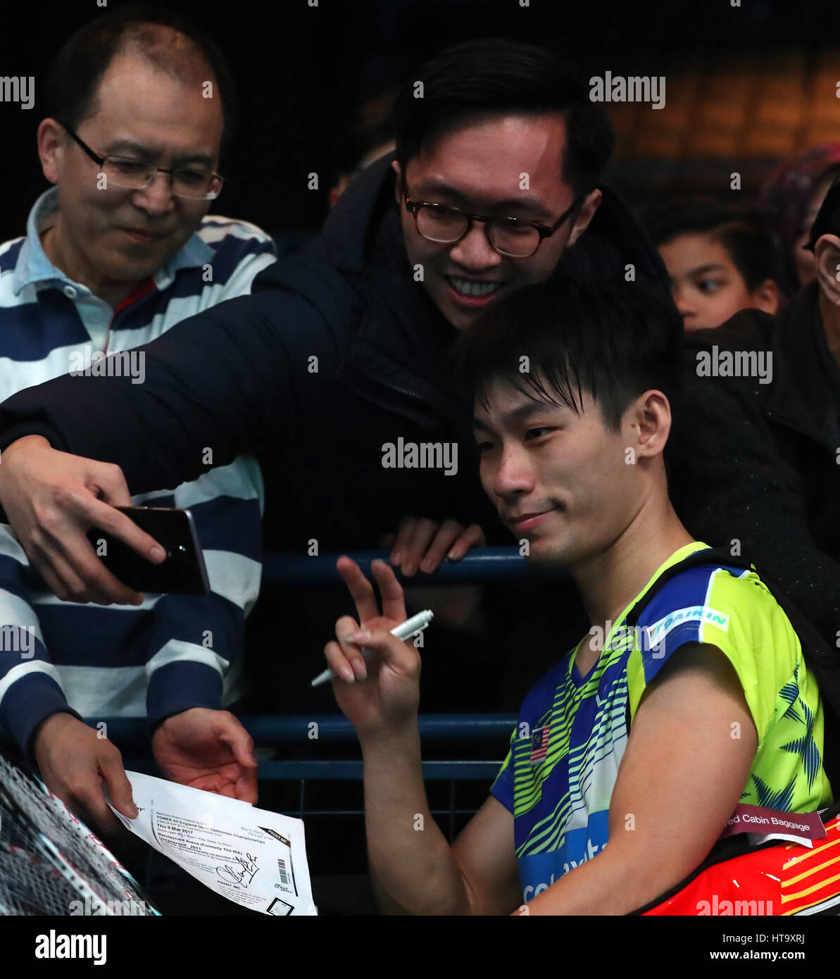 Malaysia's Peng Soon Chan poses with fans after winning his Mixed ...