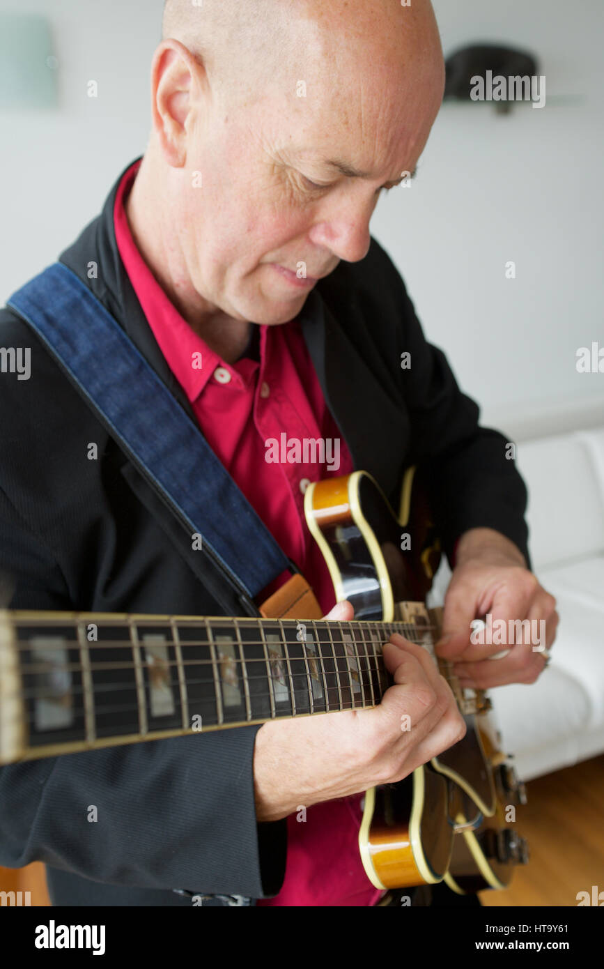 Rob Koral guitarist with Blue Commotion on location Stock Photo - Alamy