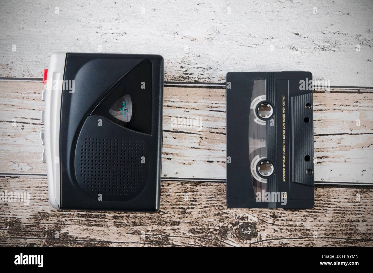 Old tape player, recorder and casette on wooden background. Top view ...
