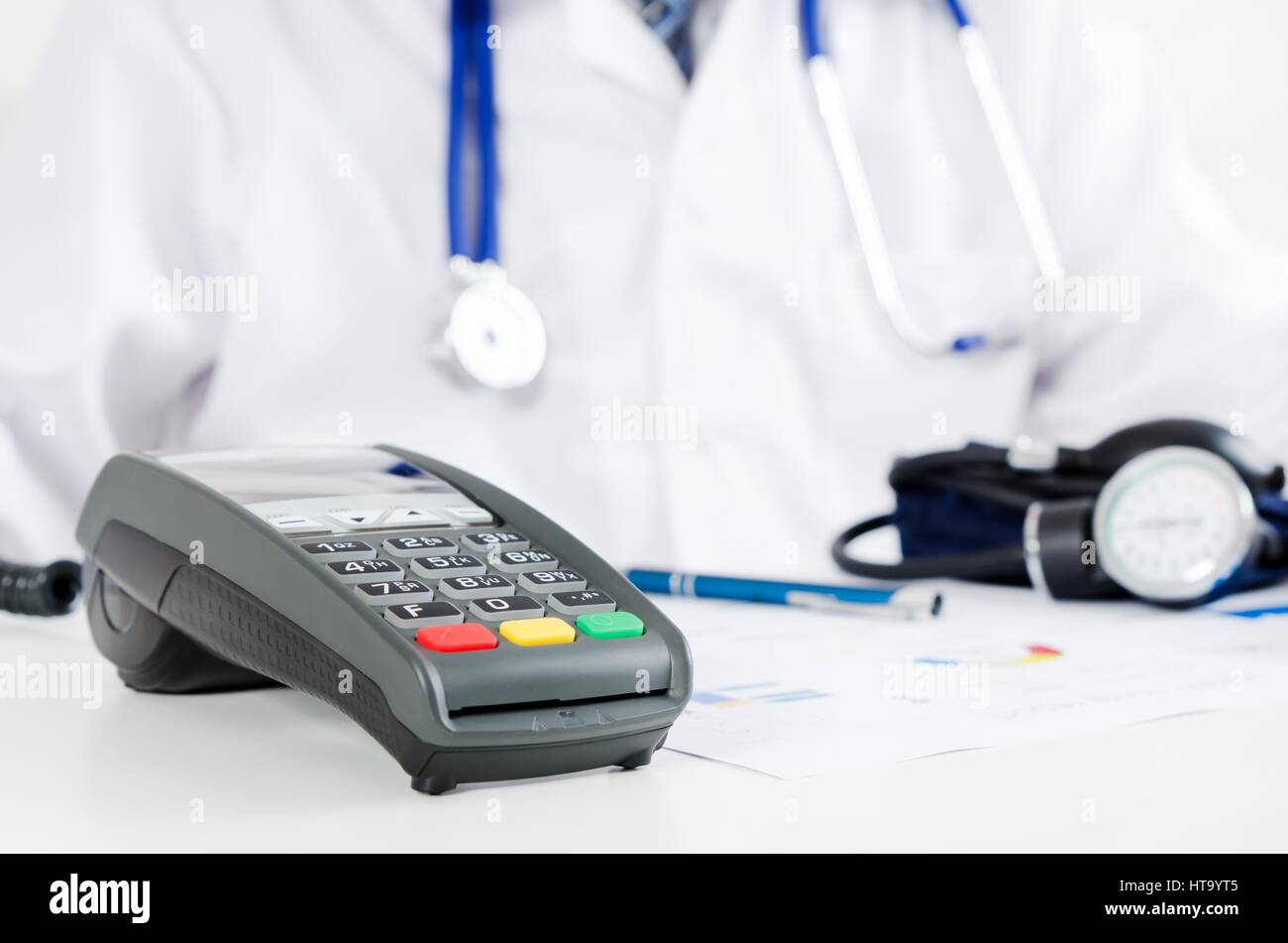 POS terminal in doctor's office. Pay for private health care concept ...