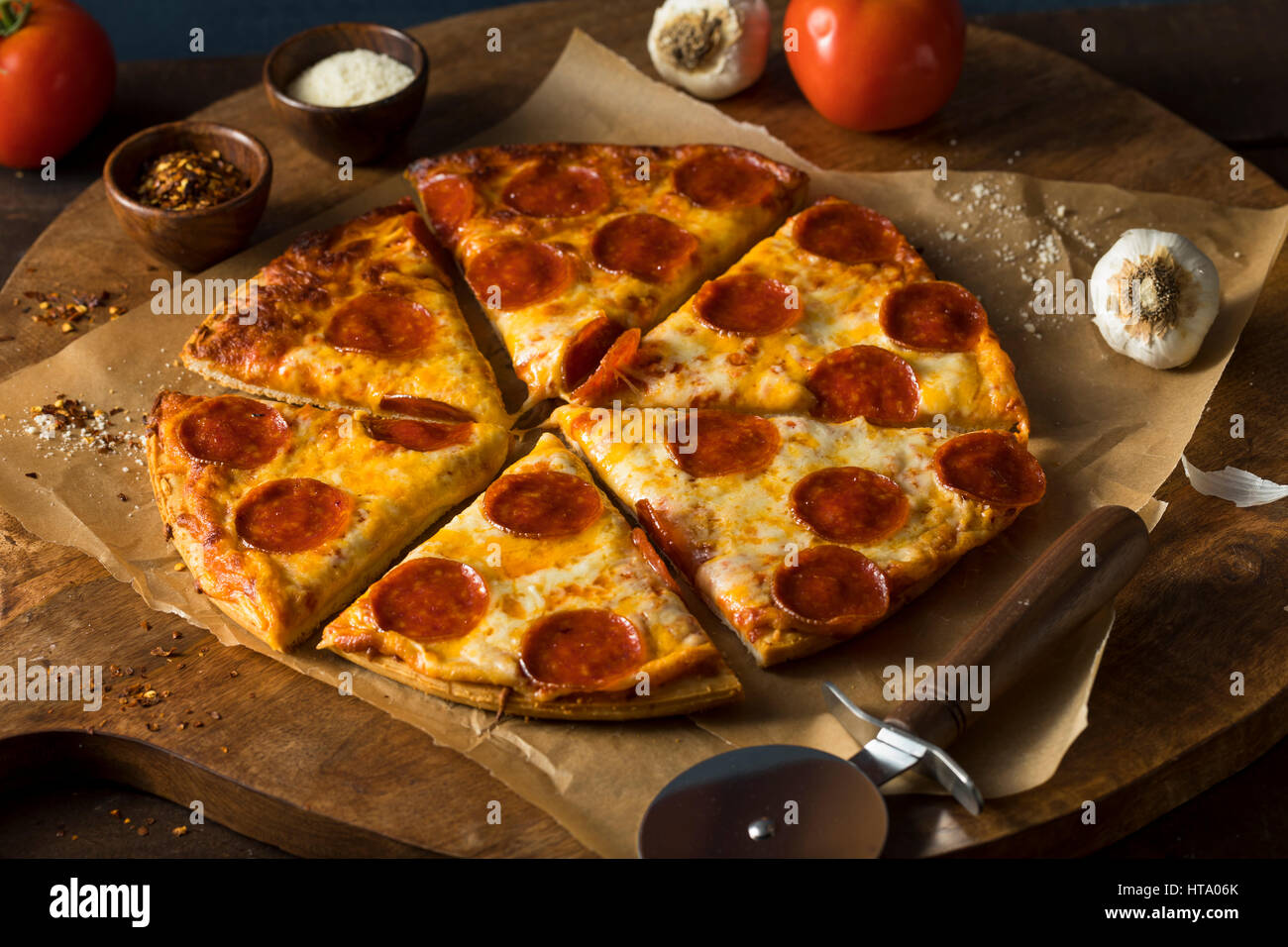 Cheap Greasy Frozen Pepperoni Pizza Ready to Eat Stock Photo - Alamy