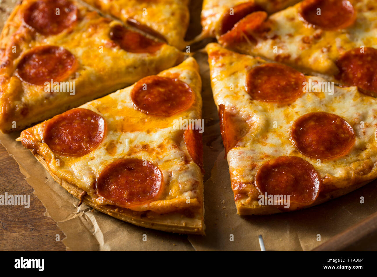 Cheap Greasy Frozen Pepperoni Pizza Ready to Eat Stock Photo - Alamy